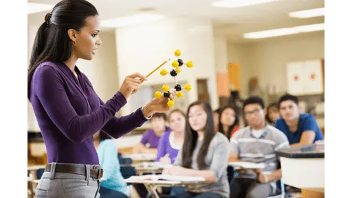 Teacher in science classroom | royalty free image